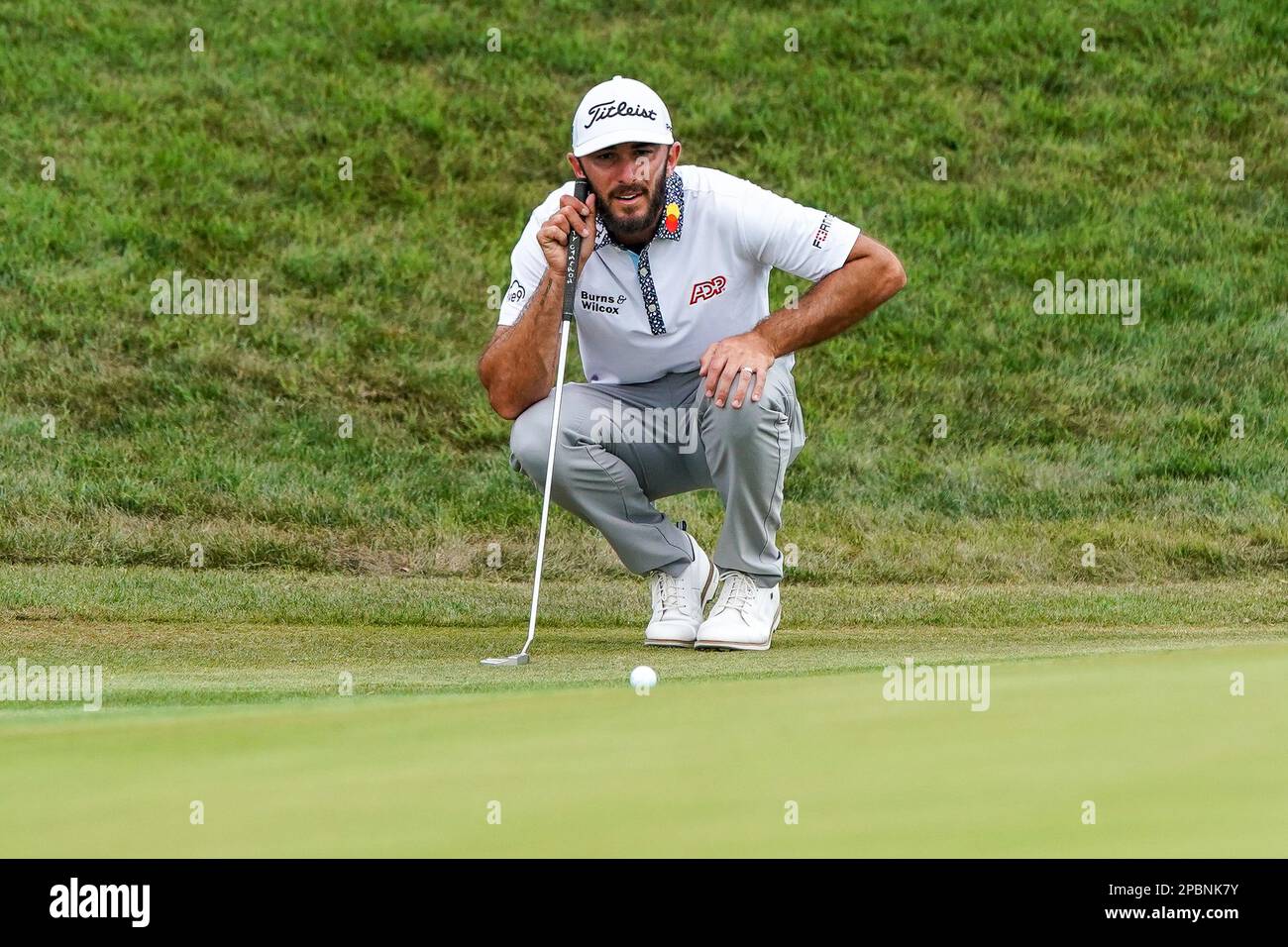 Ponte Vedra Beach, Florida, USA. 12th Mar, 2023. Max Homa lines up a putt on the 18th green ...
