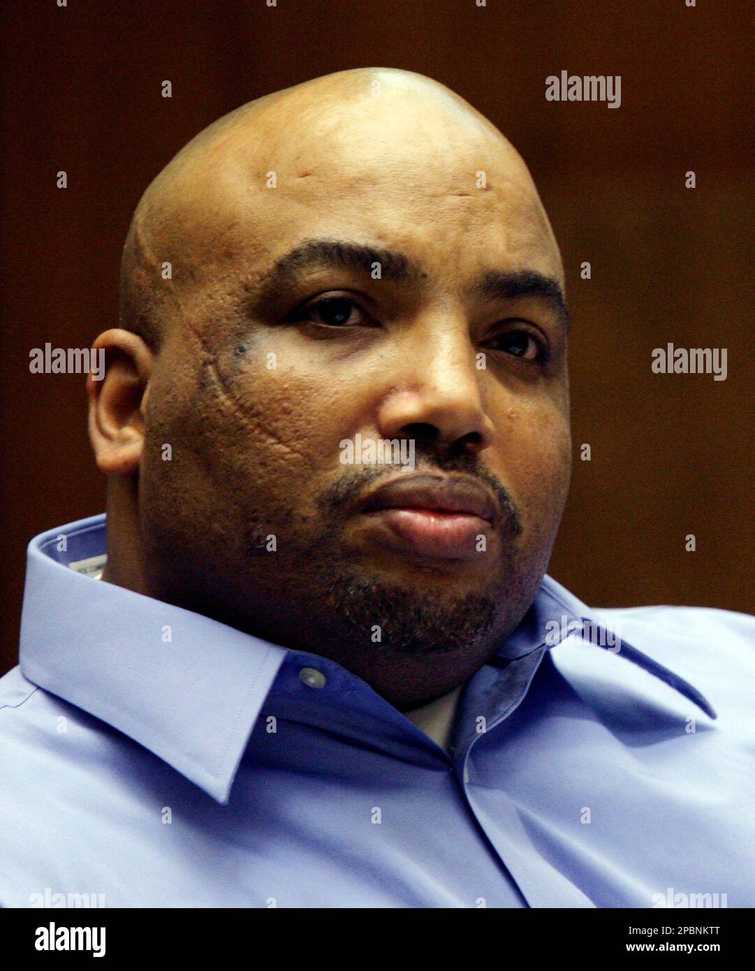 Chester Turner looks on in a courtroom during opening statements in his ...