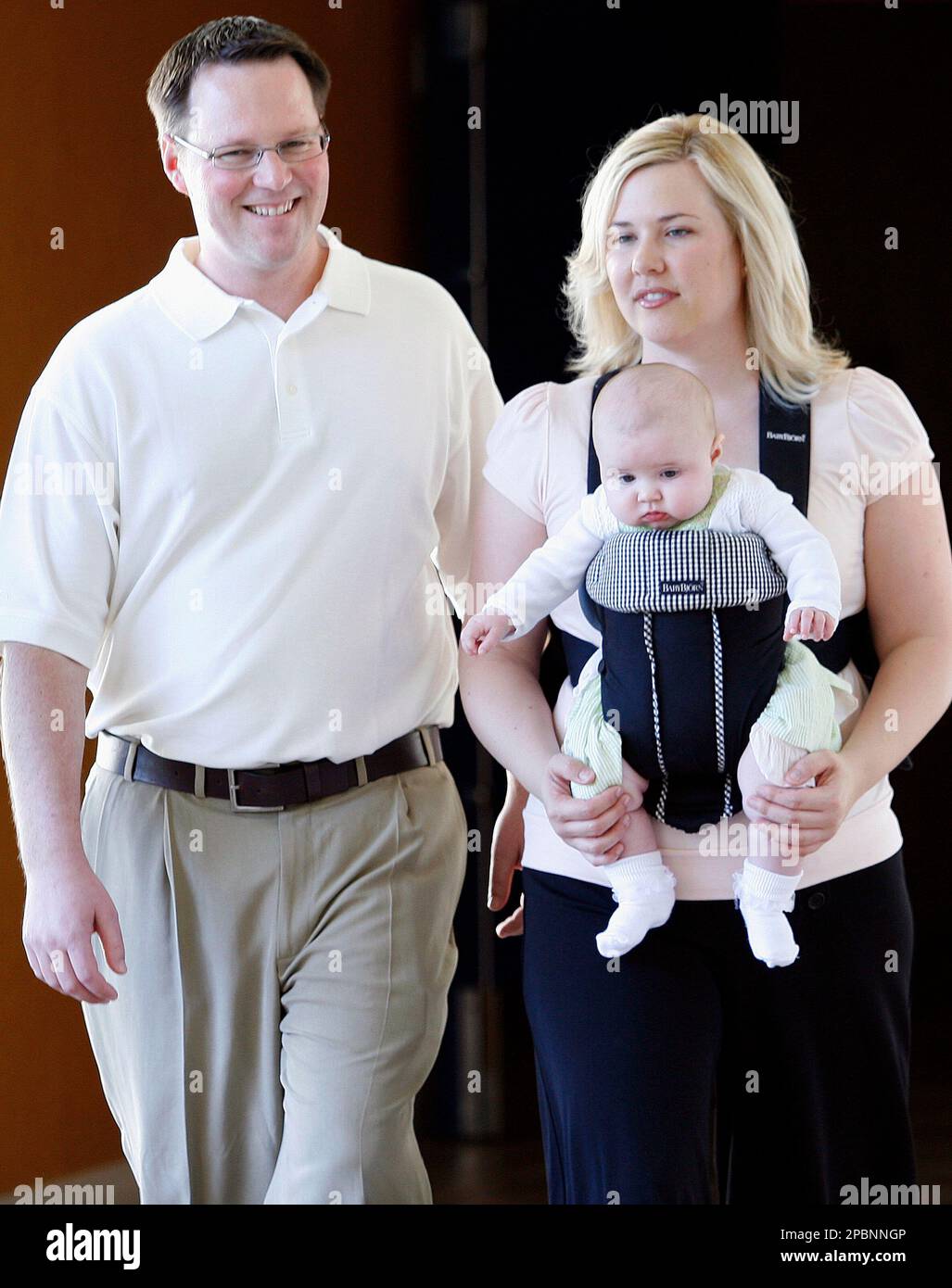 Kurt Barrett, Deanna Barrett and their five-month-old daughter Ava walk ...