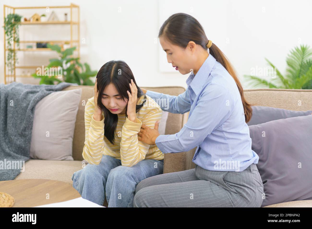 Female psychologist comforting and encourage stressed patient while ...