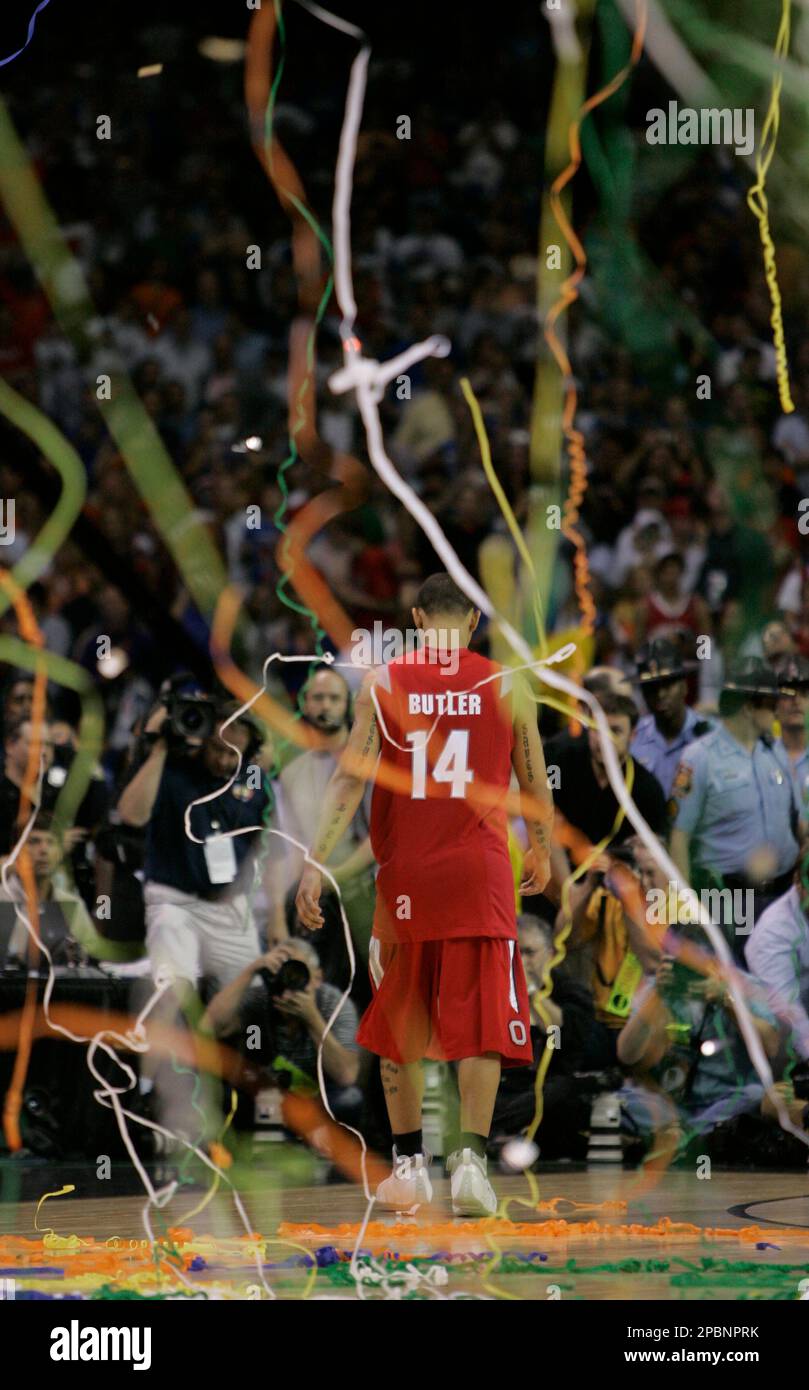 Ohio State guard Jamar Butler walks off he court as confetti falls ...