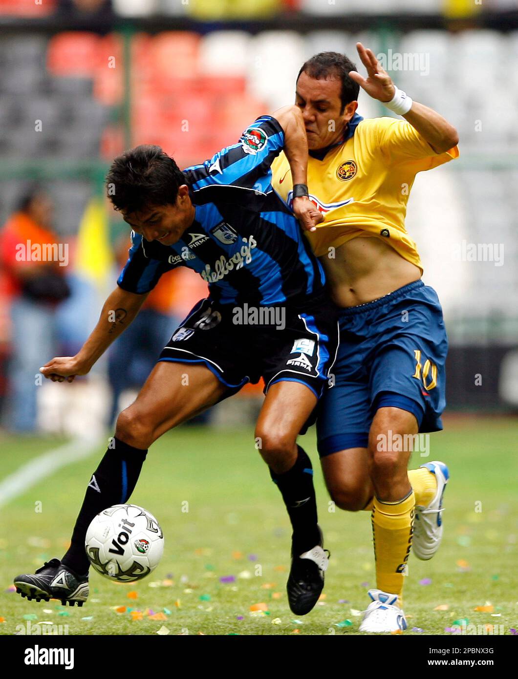 America's Cuauhtemoc Blanco, right, fights for the ball with Queretaro ...