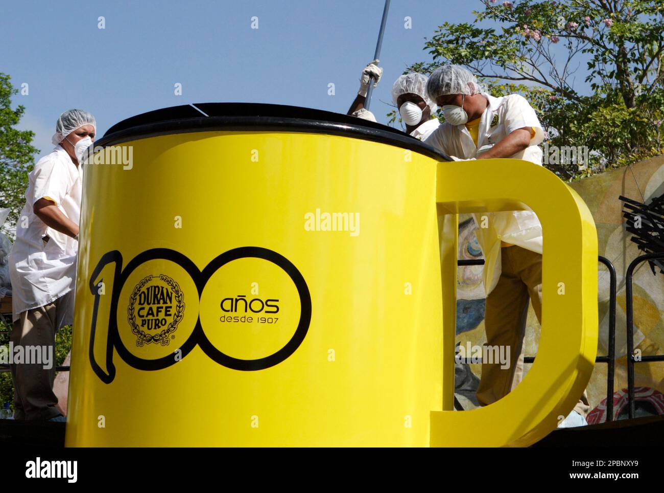 Workers stir 750 gallons of coffee in an oversized coffee mug in Panama ...