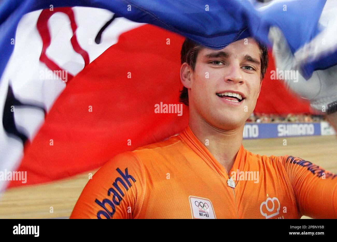 Dutch cyclist Theo Bos celebrates after won the Men's Sprint gold medal ...