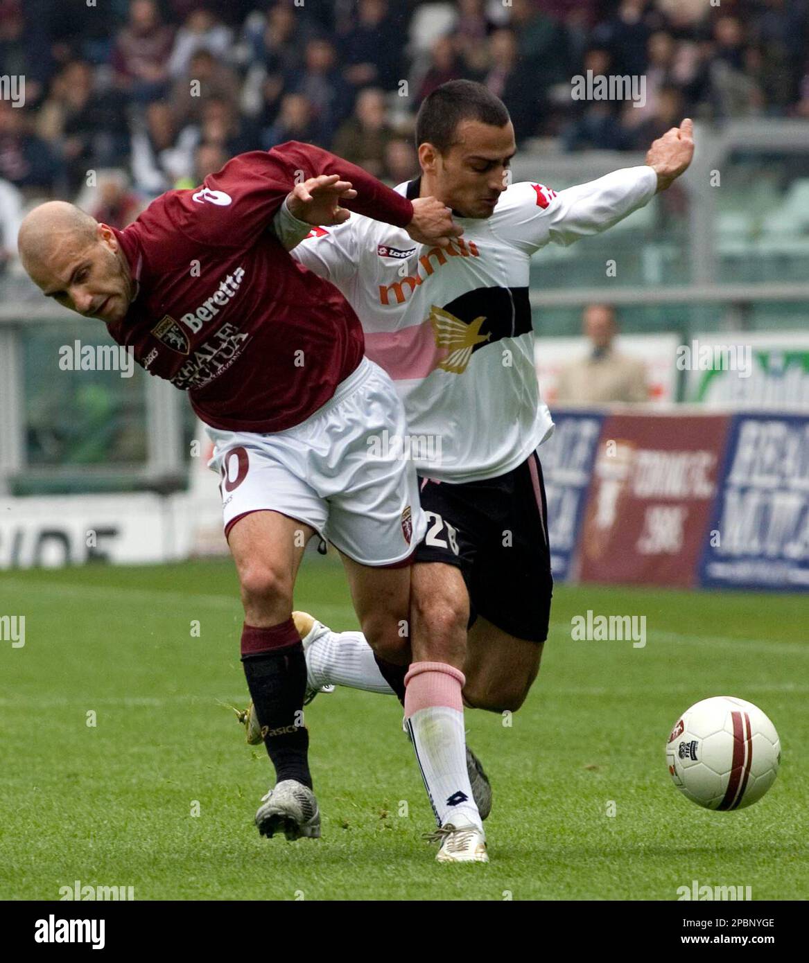 Torino's forward Alessandro Rosina, left, and Palermo's midfielder Maurizio Ciaramitaro fight ...