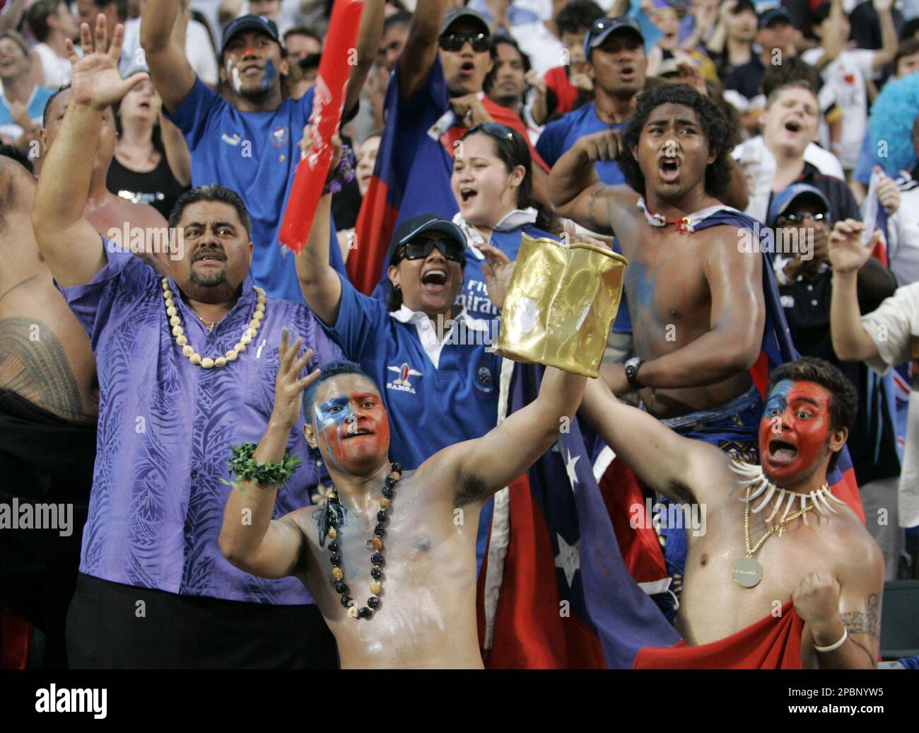Fans of Samoa celebrate during the final match against Fiji of the Hong ...