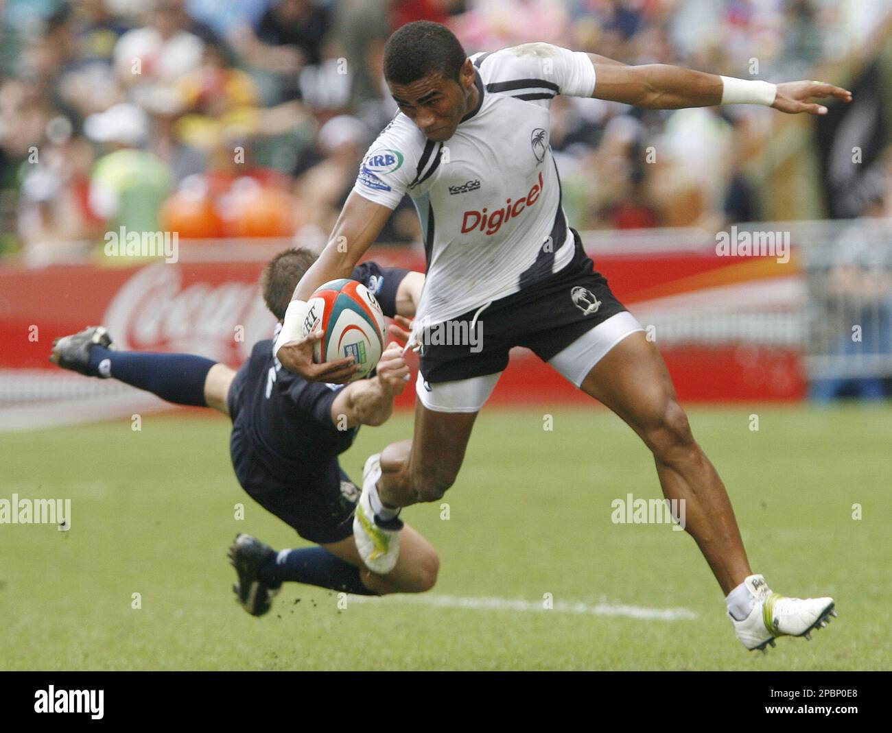 Fiji's William Ryder, front, is tackled by Scotland's Jamie Hunter in ...