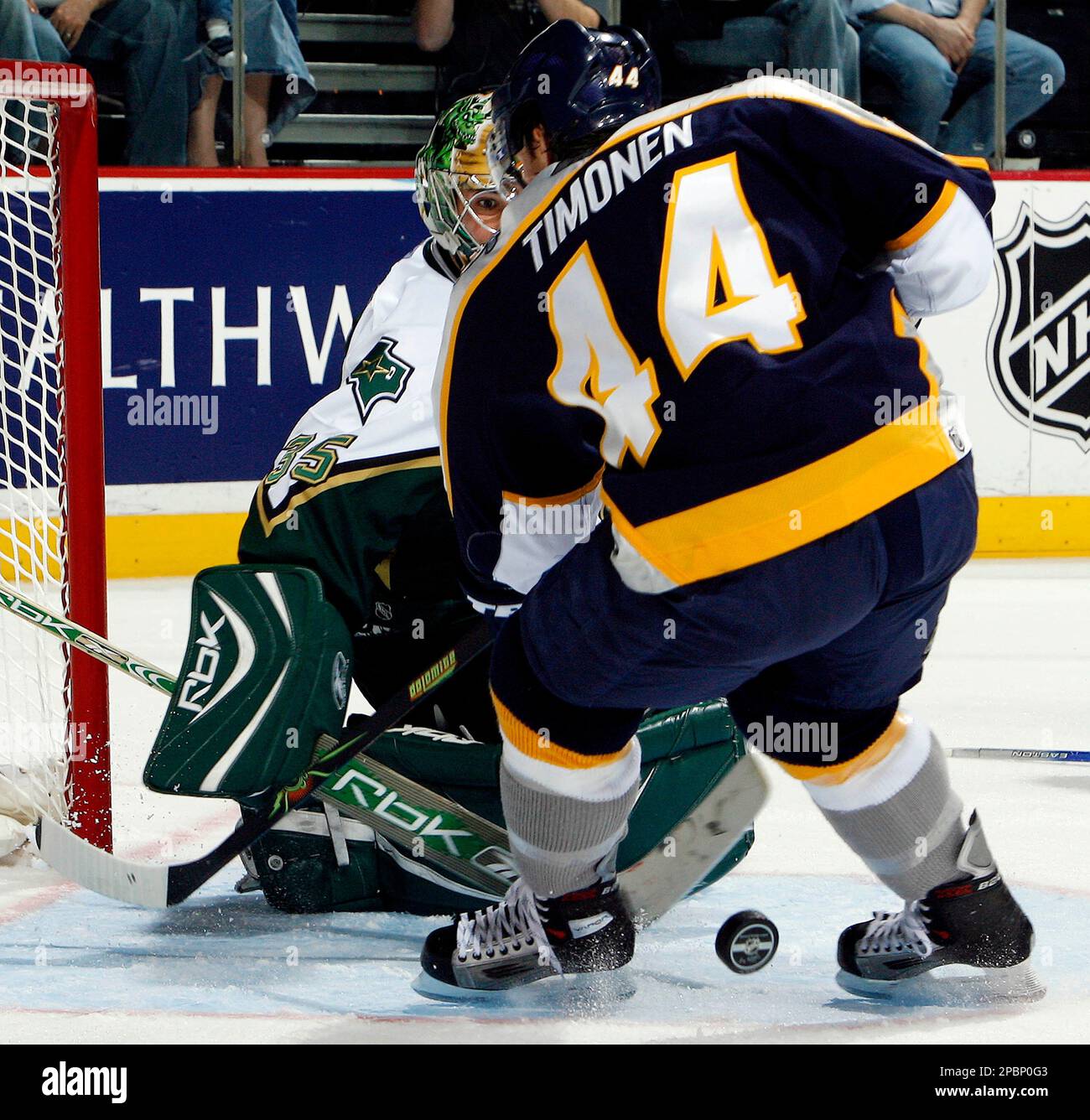 Dallas Stars goalie Marty Turco, left, blocks a shot from Nashville ...
