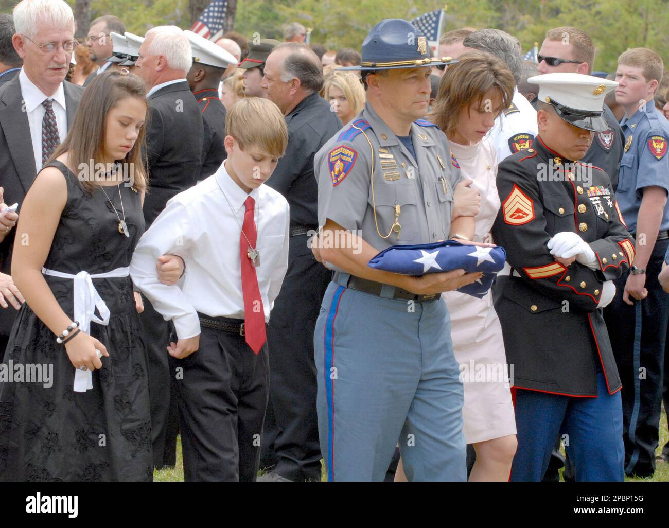 The family of Cpl. Dustin Lee, from left, sister Madyson Lee, brother ...