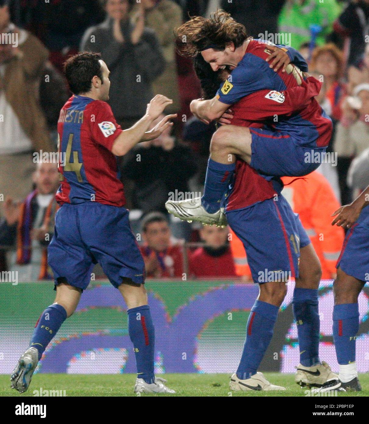Barcelona player Lionel Messi, top, celebrates his goal with teammates ...