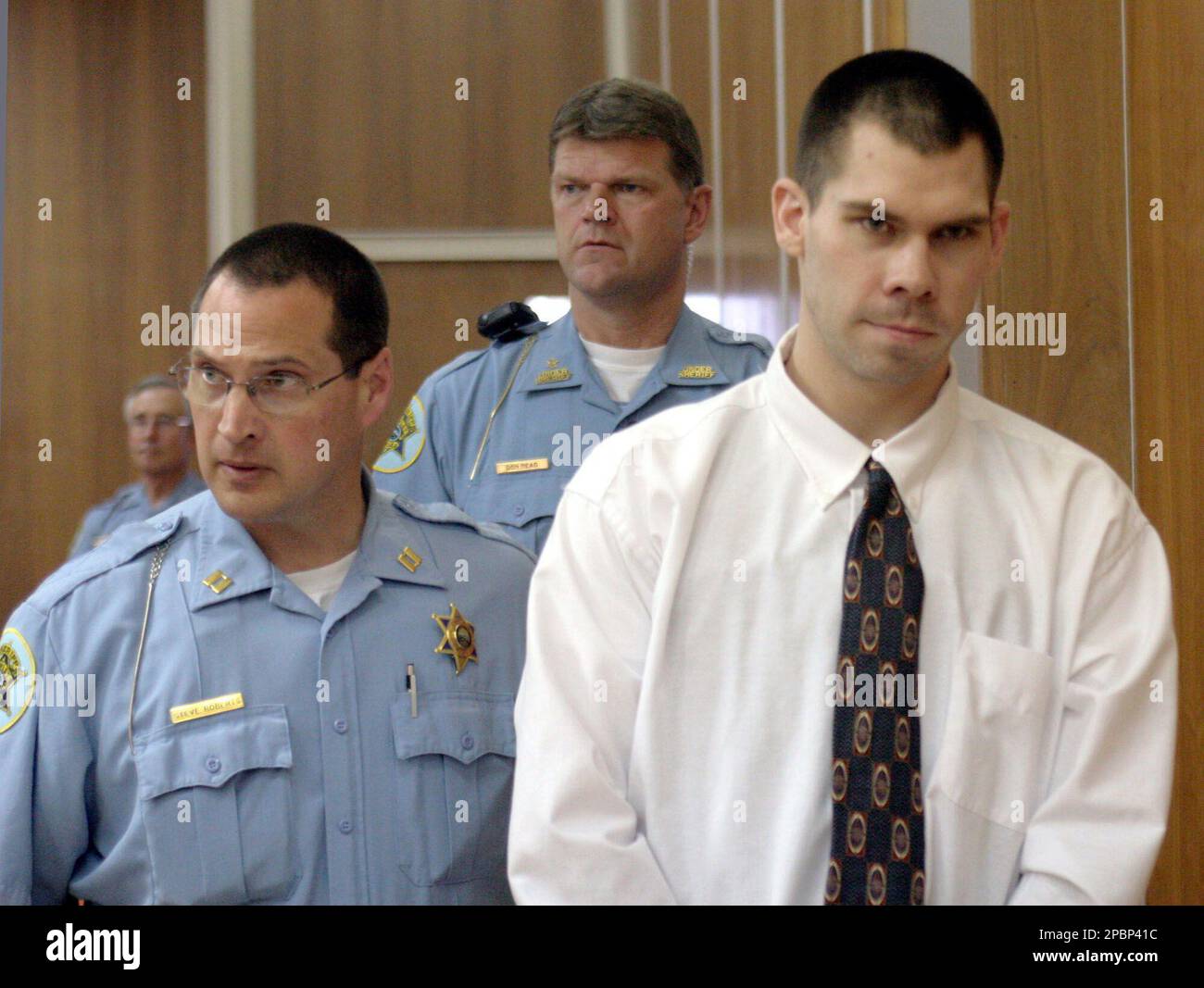 Justin Thurber is escorted into a district court room Friday March 30 ...