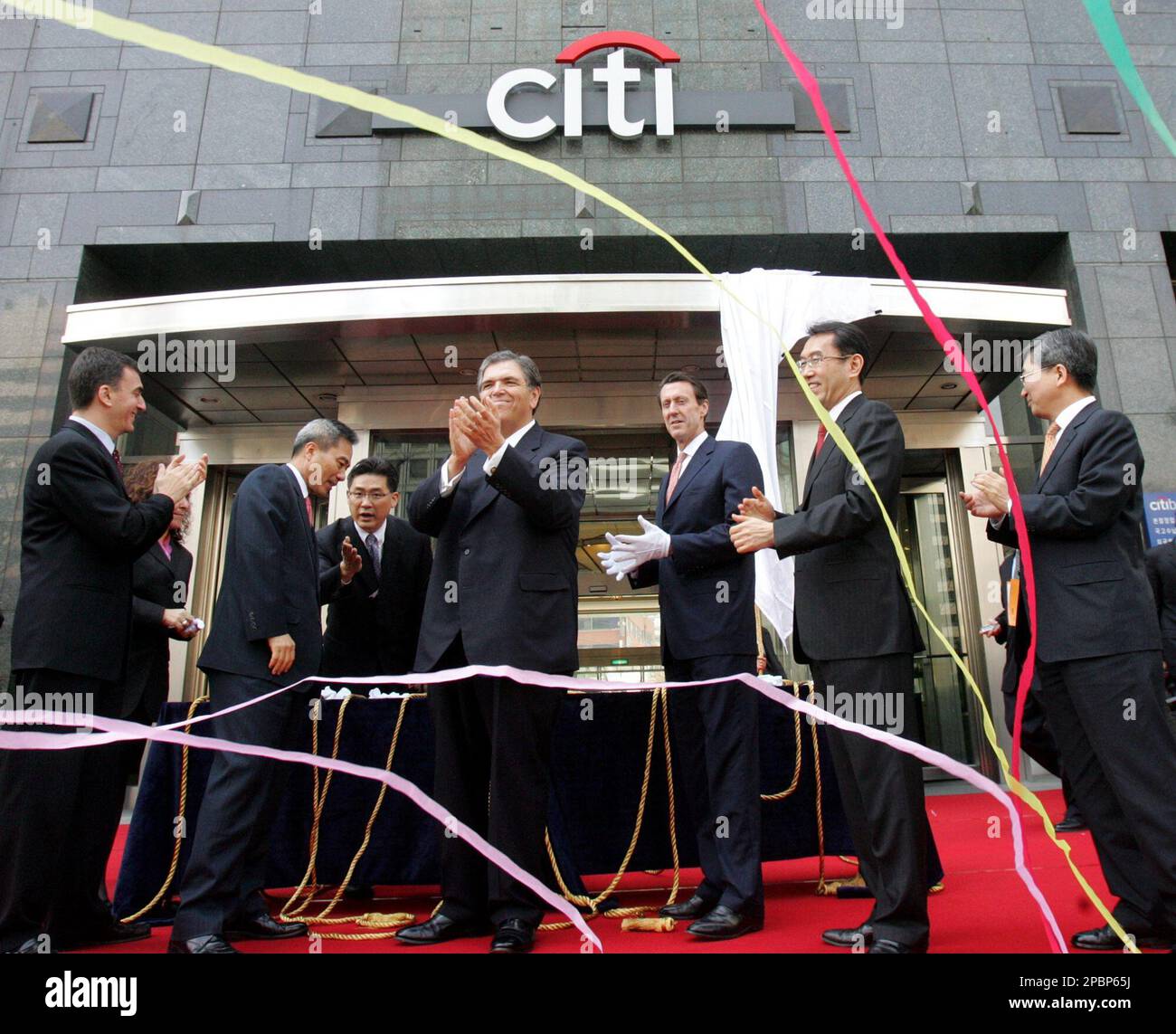 Citigroup Chairman and Chief Executive Charles Prince, center, and ...