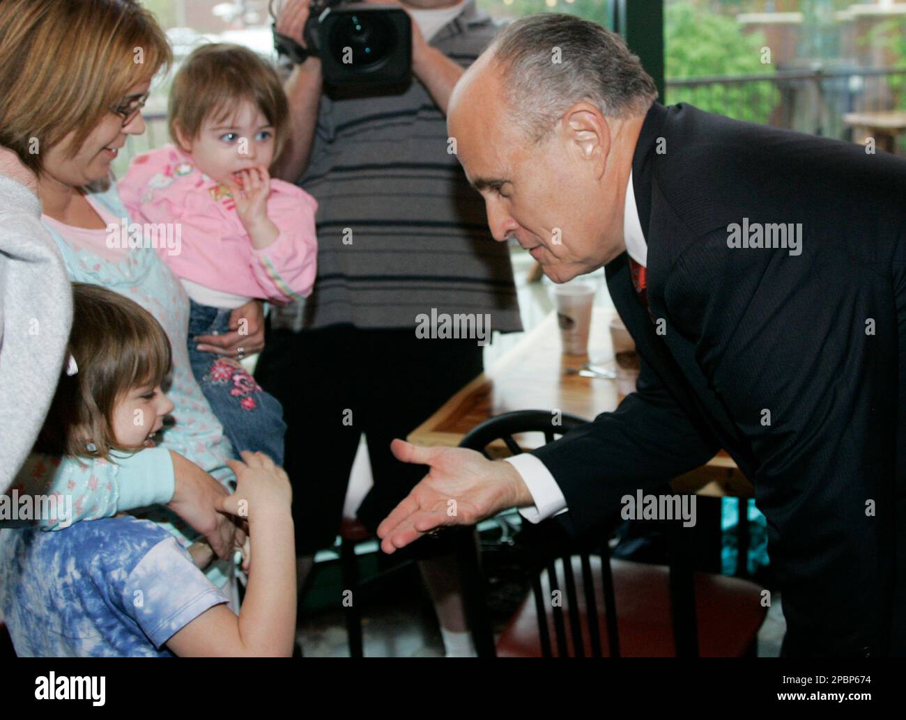 Republican presidential hopeful Rudy Giuliani, right, greets 6-year-old ...