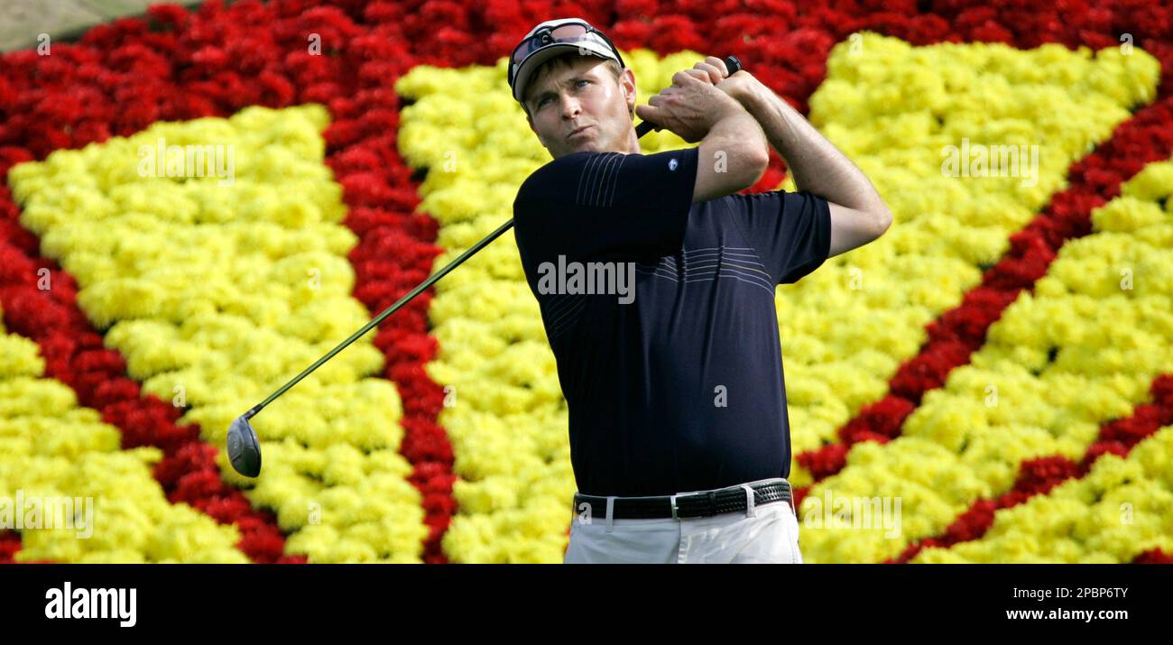 Bob Estes watches his tee shot on 18th hole during the first round of ...