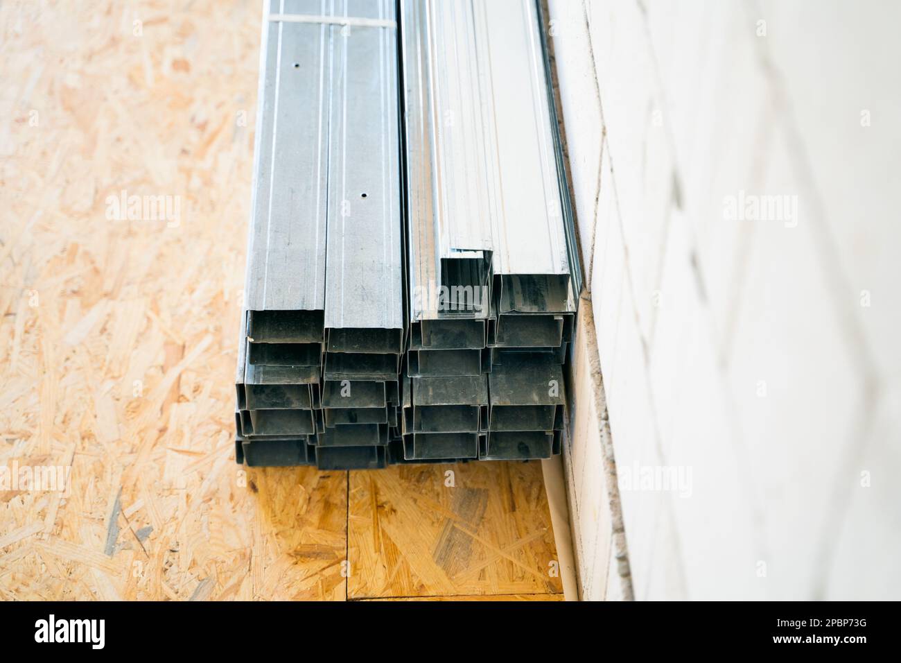 A packed metal profile lies on the floor at a construction site close ...