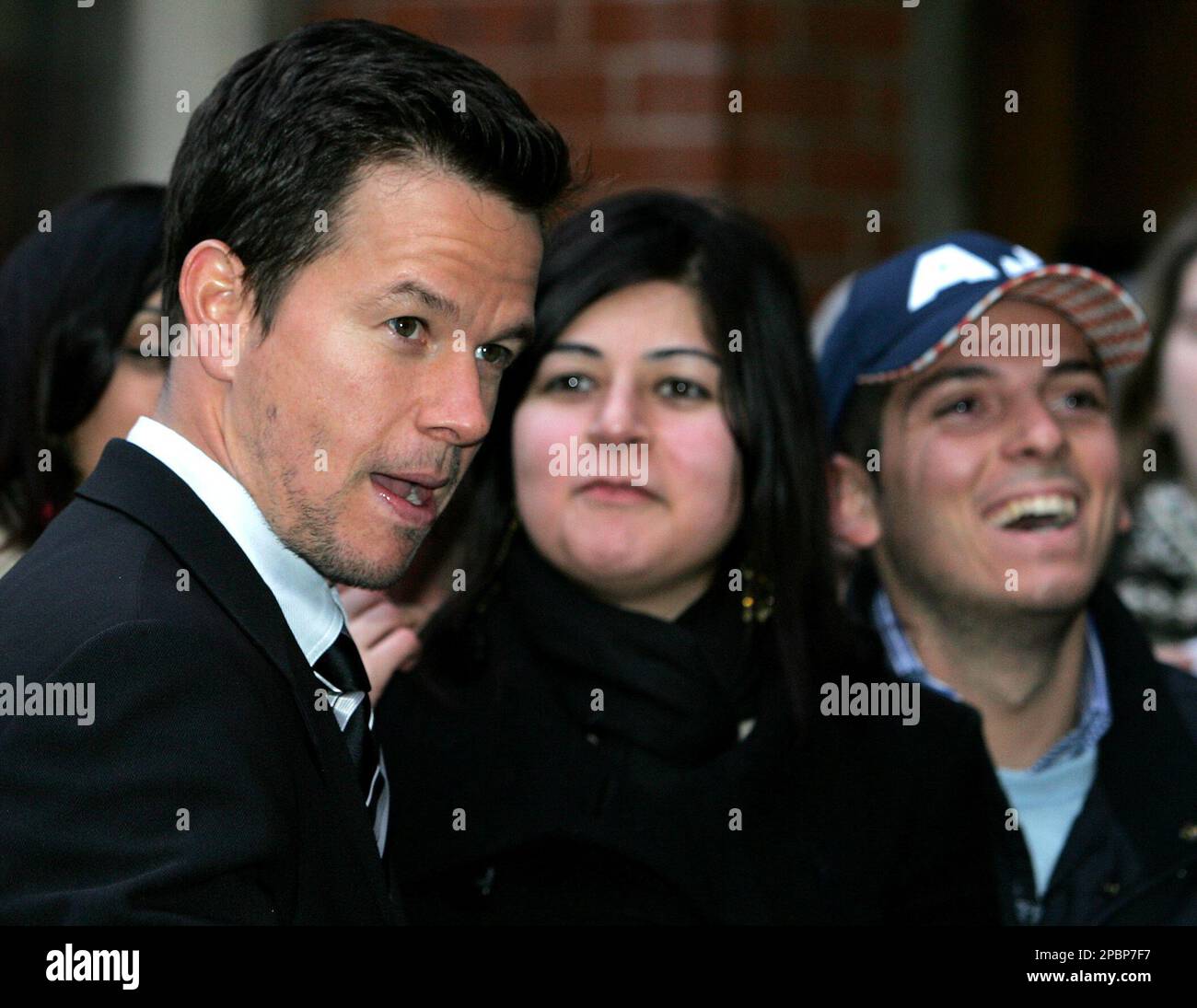 Actor Mark Wahlberg, left, meets fans as he arrives for the UK premiere ...