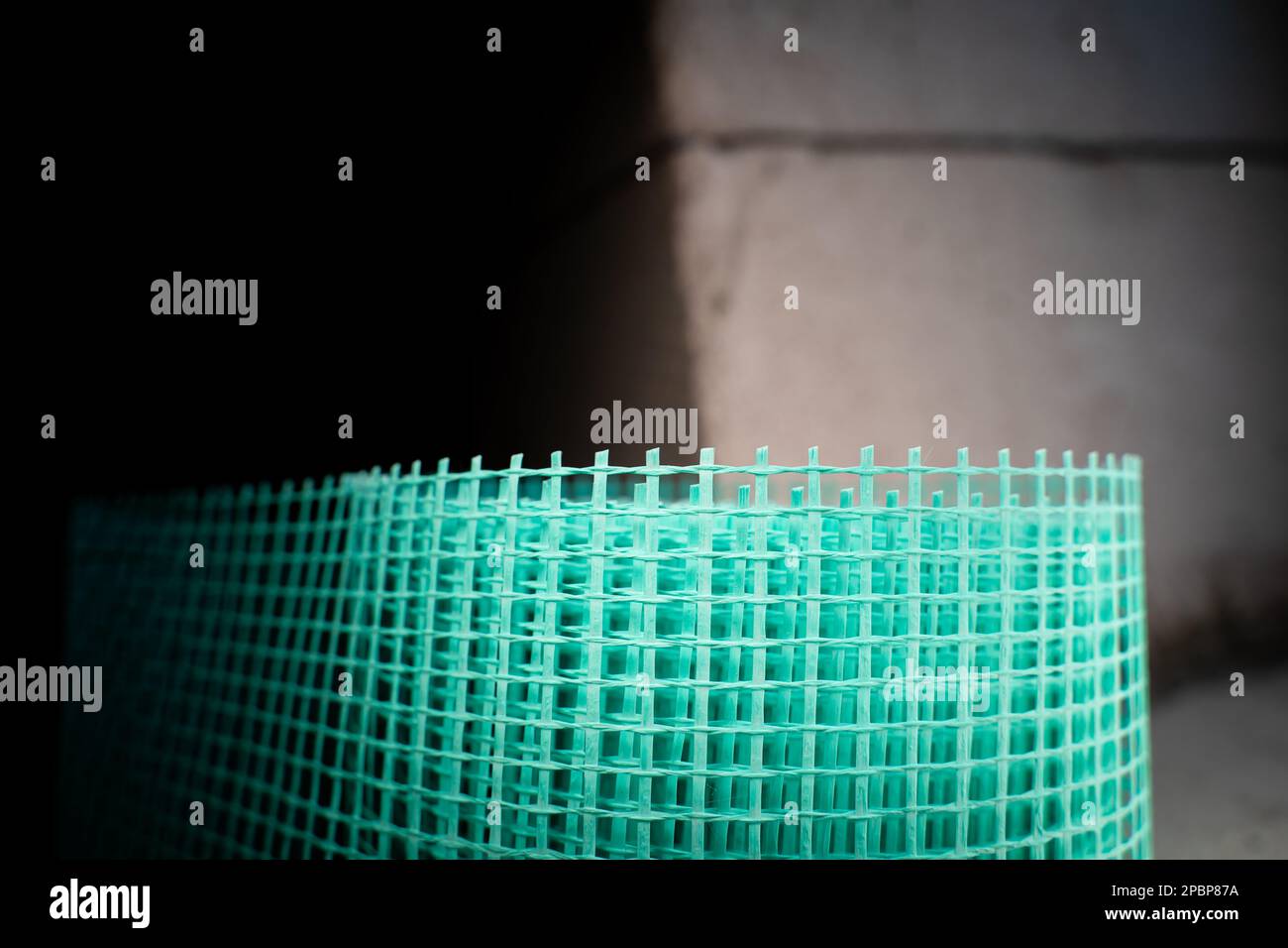 Plastic reinforcing facade mesh in green color close-up. Plaster mesh ...