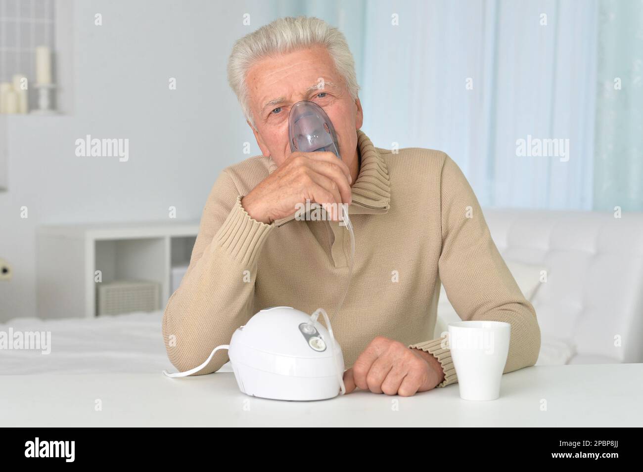 Portrait of sick old man with inhaler Stock Photo - Alamy