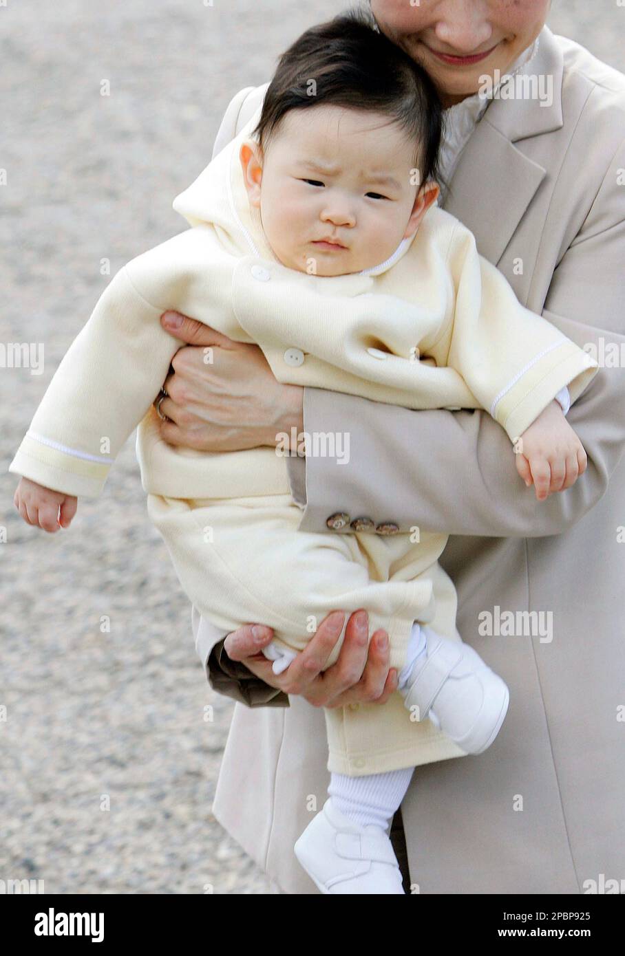Prince Hisahito, carried by his mother Princess Kiko, arrives at the ...