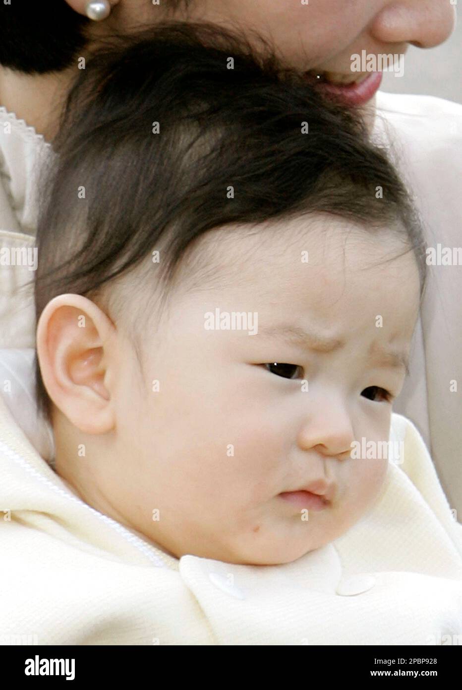 Prince Hisahito, carried by his mother Princess Kiko, arrives at the ...