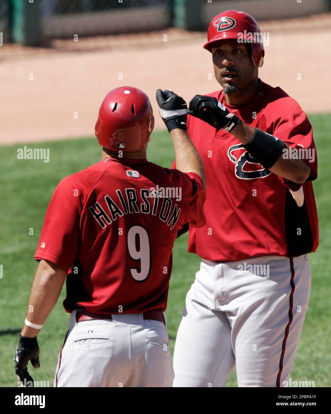 Arizona Diamondbacks' Tony Clark, right, is congratulated by teammate ...