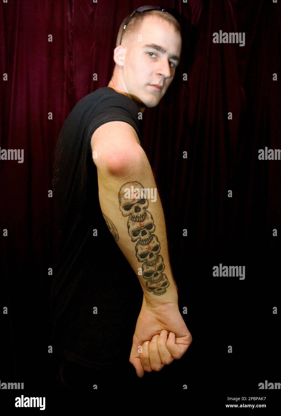 Marine Cpl. Jeremy Slaton shows off his tattoo which reads "Death ...