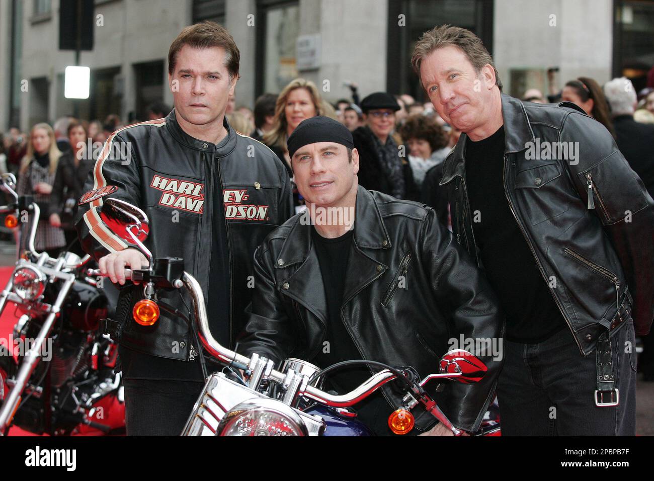 US actors John Travolta, centre, Tim Allen, right, and Ray Liotta pose ...