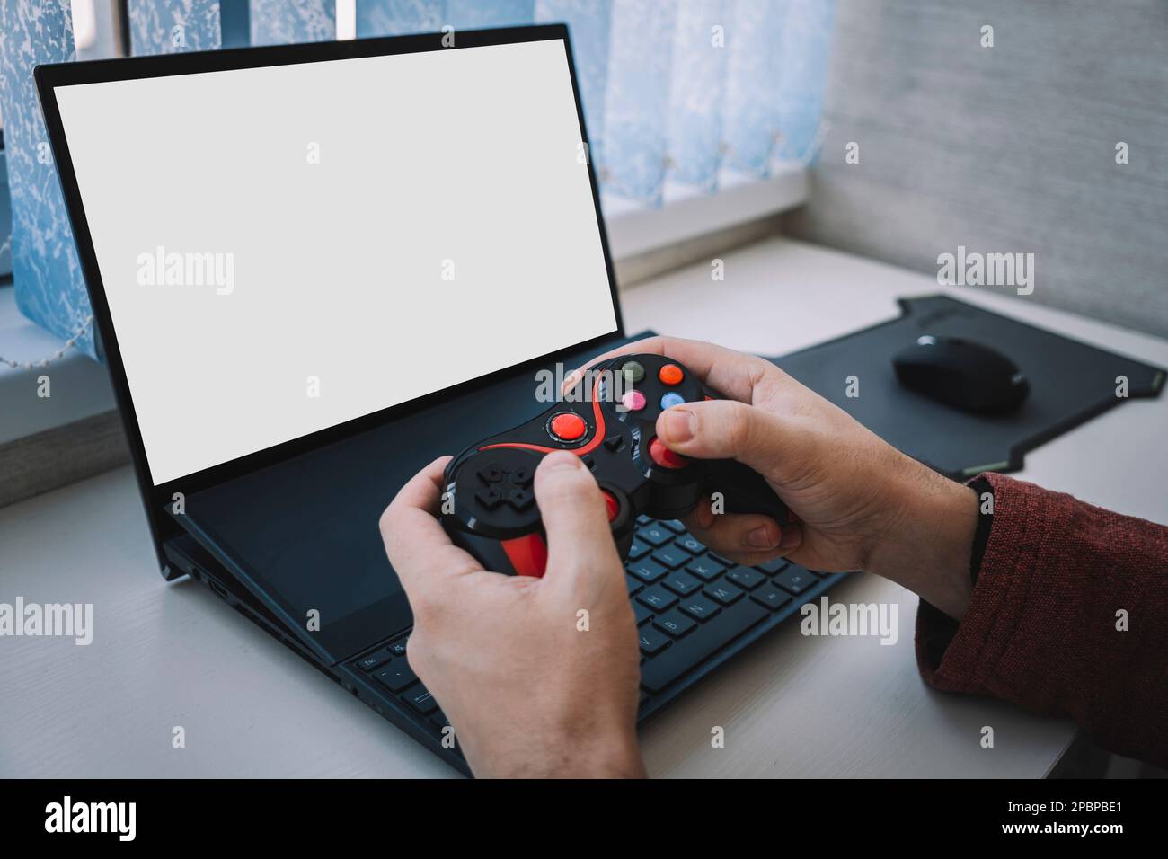 Open laptop computer with a blank white screen with copy space standing ...