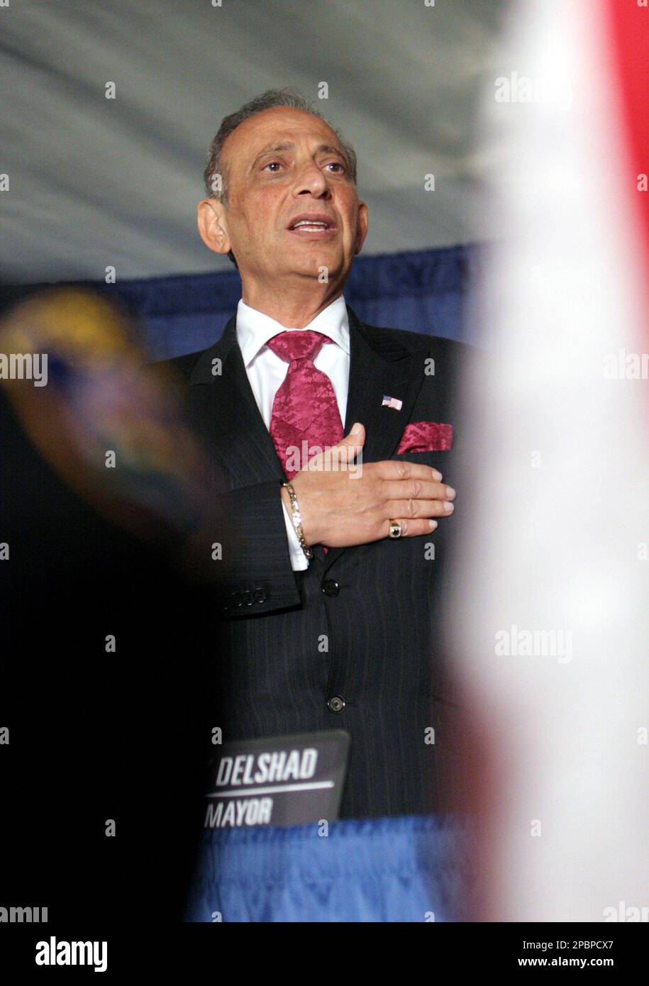 Jimmy Delshad says the Pledge of Allegiance before being sworn into ...