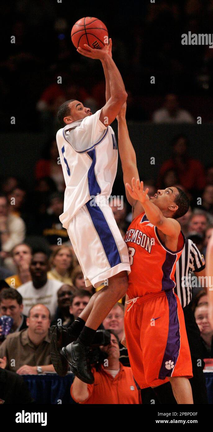 Air Force's Matt McCraw, left, shoots over Clemson's Vernon Hamilton ...