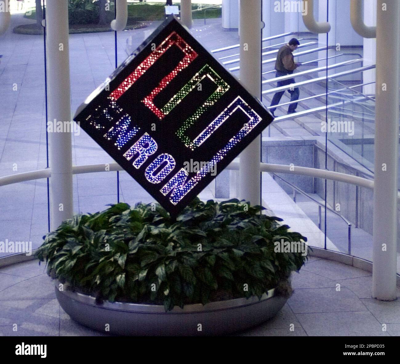 ** FILE ** A colorful revolving Enron Corp. logo spins in the lobby of ...