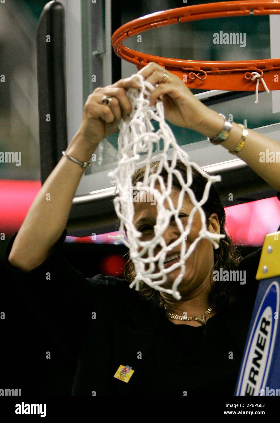 Rutgers coach C. Vivian Stringer cuts the net after Rutgers defeated ...