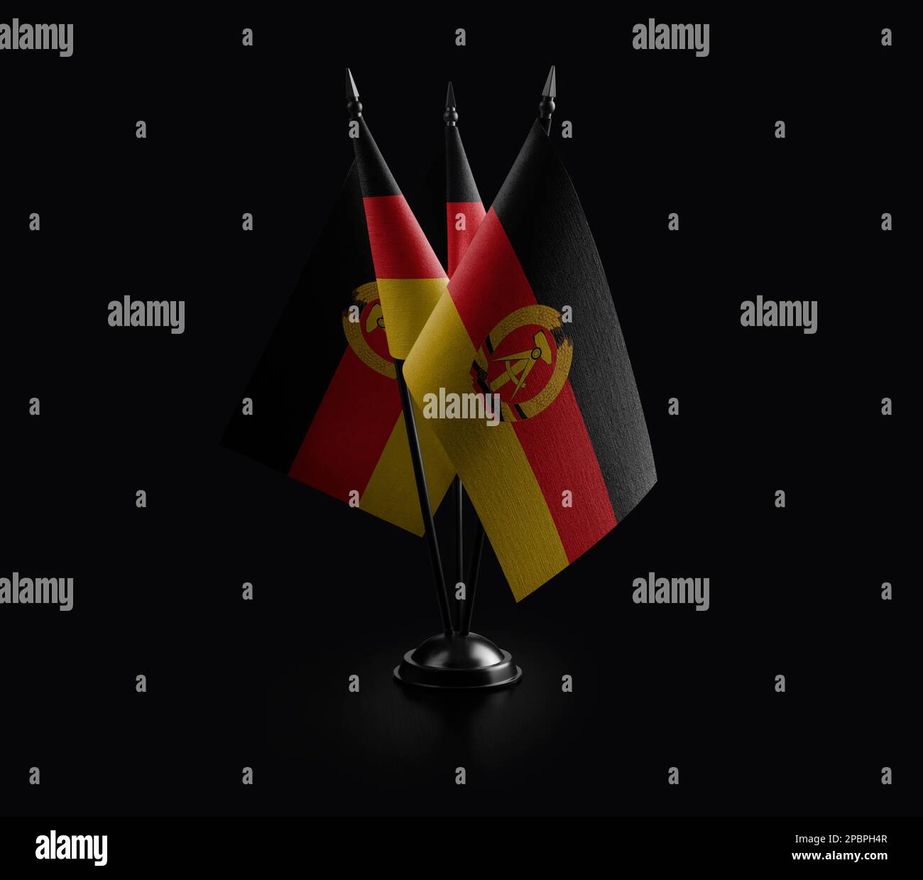 Small national flags of the DDR on a black background Stock Photo - Alamy
