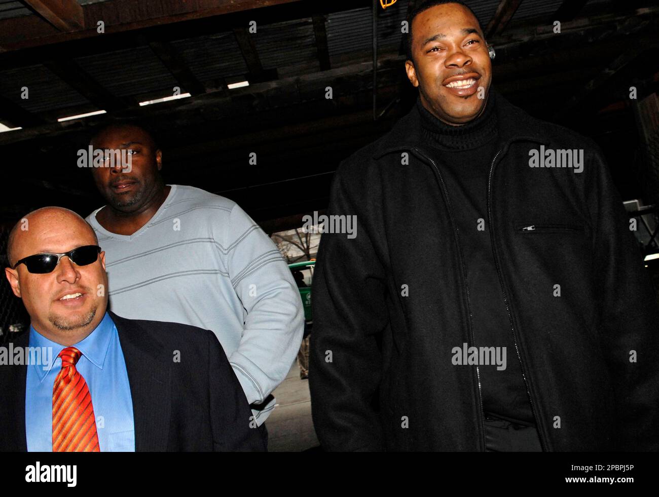 Rapper Busta Rhymes, right, whose birth name is Trevor Smith, enters ...
