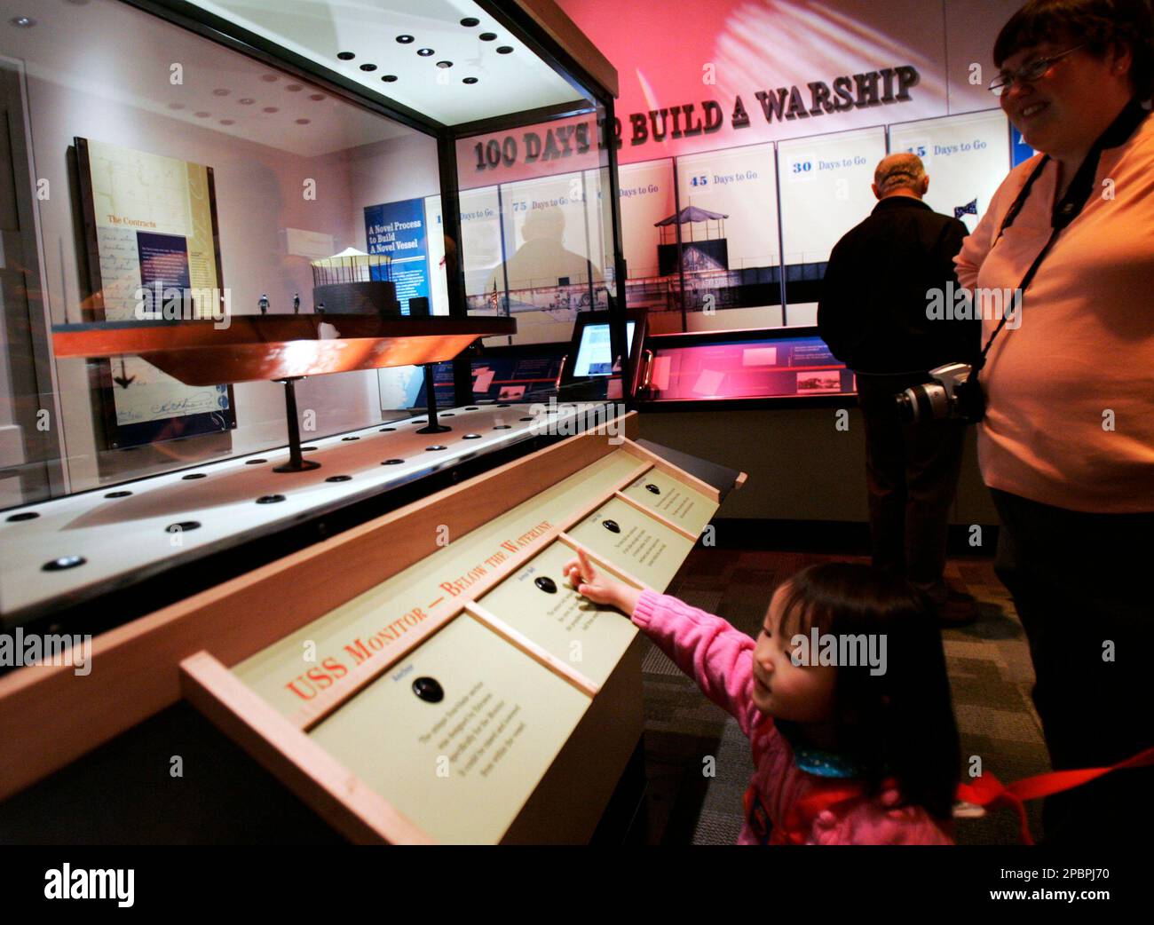 ** FOR IMMEDIATE RELEASE **Visitors work an interactive display ...