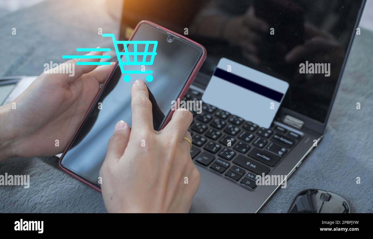 Woman using credit card filling billing information on laptop computer shopping in ecommerce ...