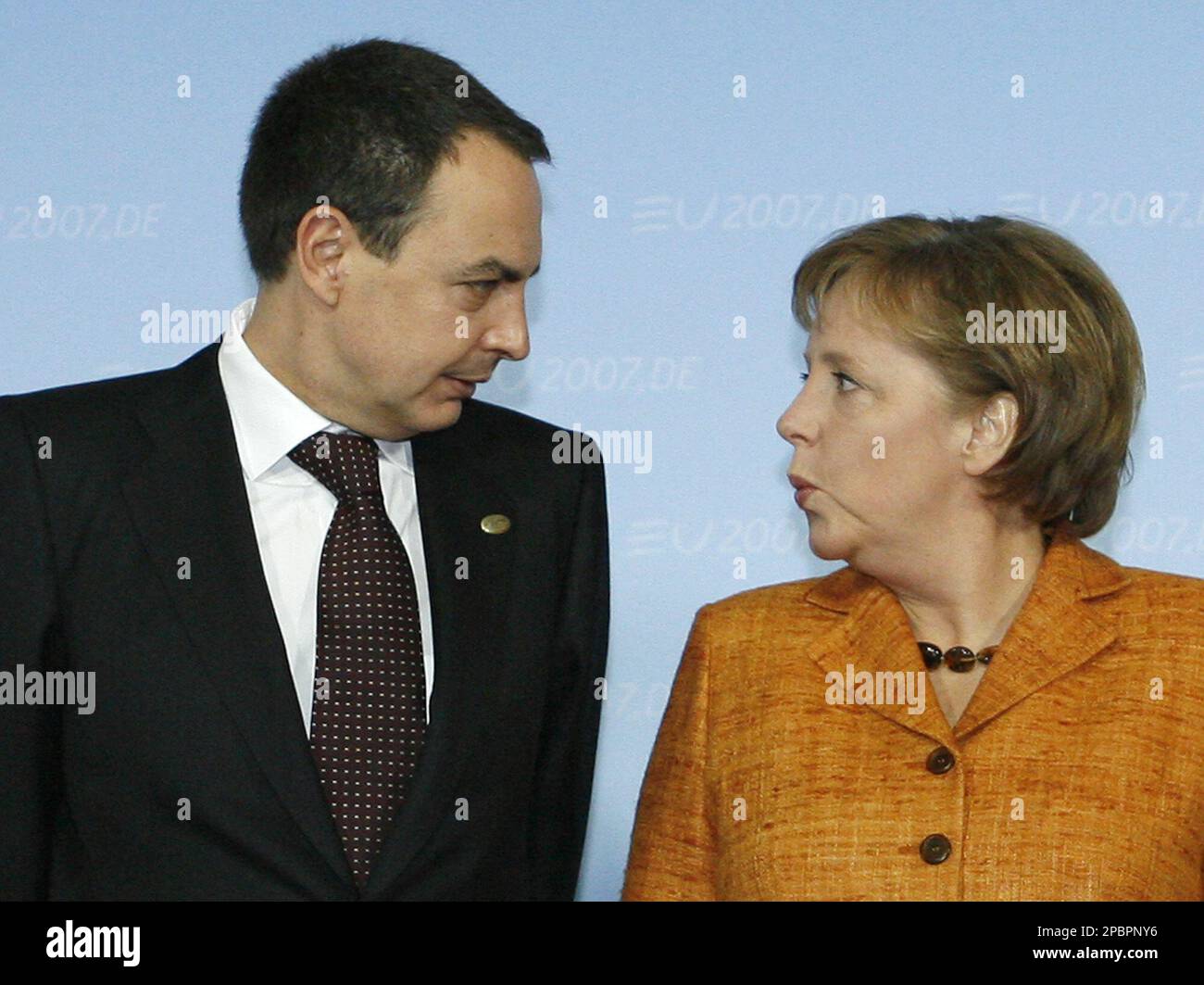 German Chancellor Angela Merkel, right, shares a word with Spanish ...
