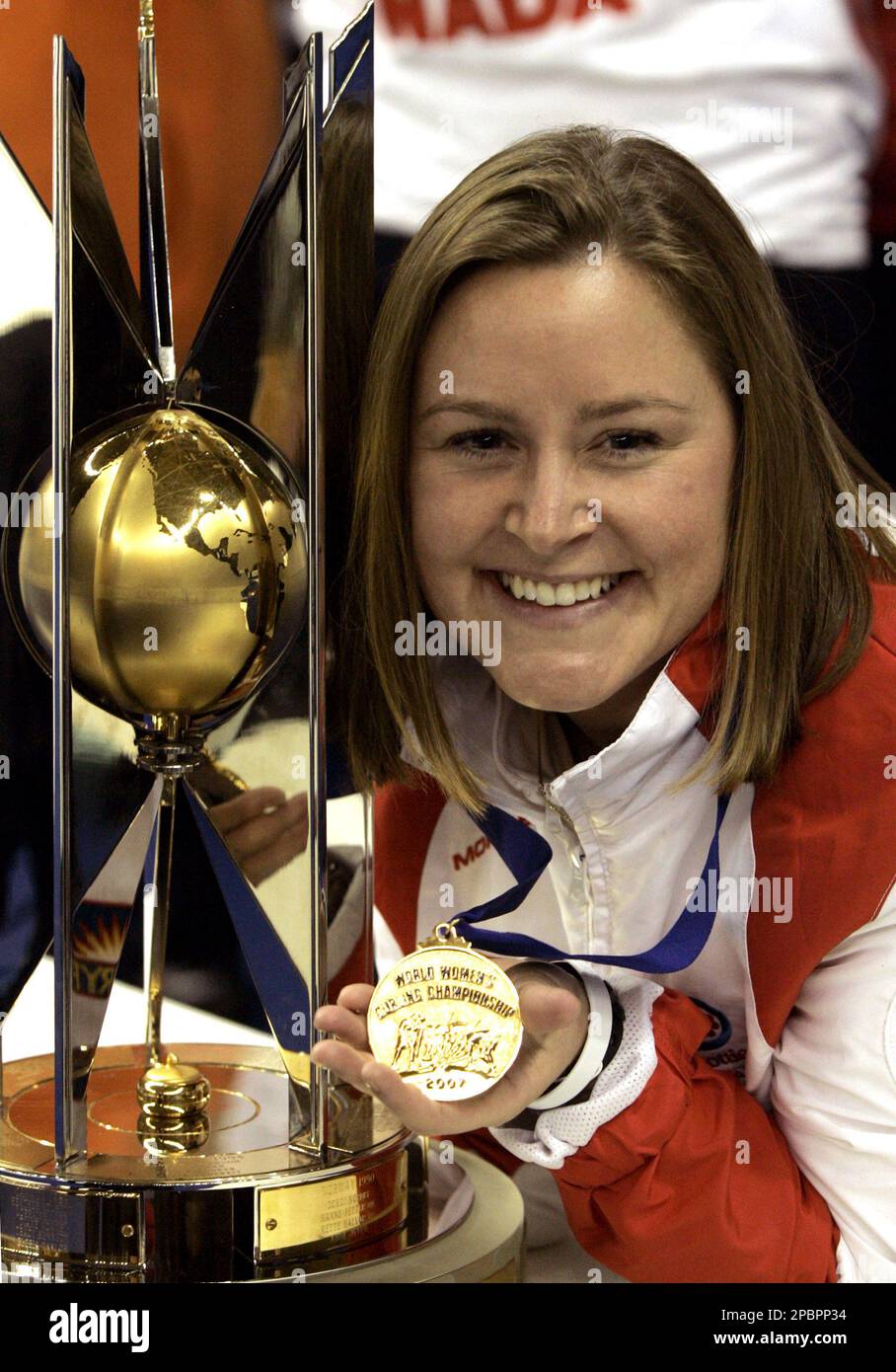 Canada's skip Kelly Scott pose for photos with the gold trophy and ...