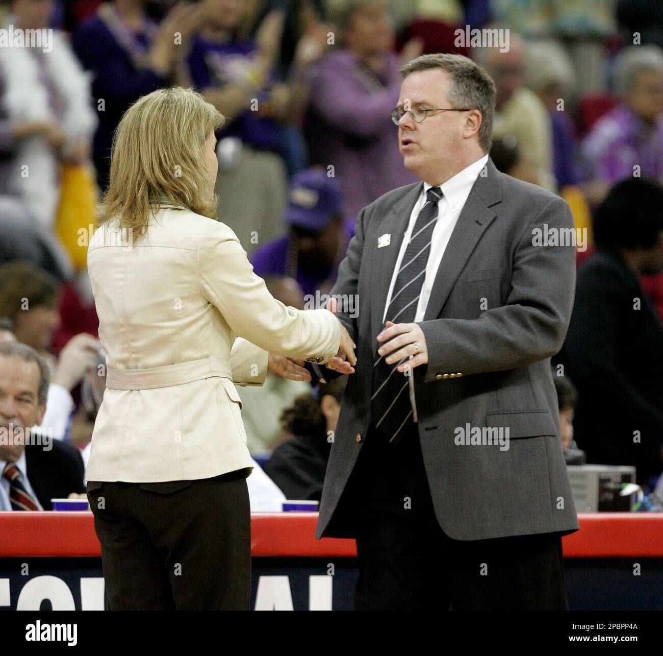 Florida State coach Sue Semrau, left, congratulates LSU coach Bob ...