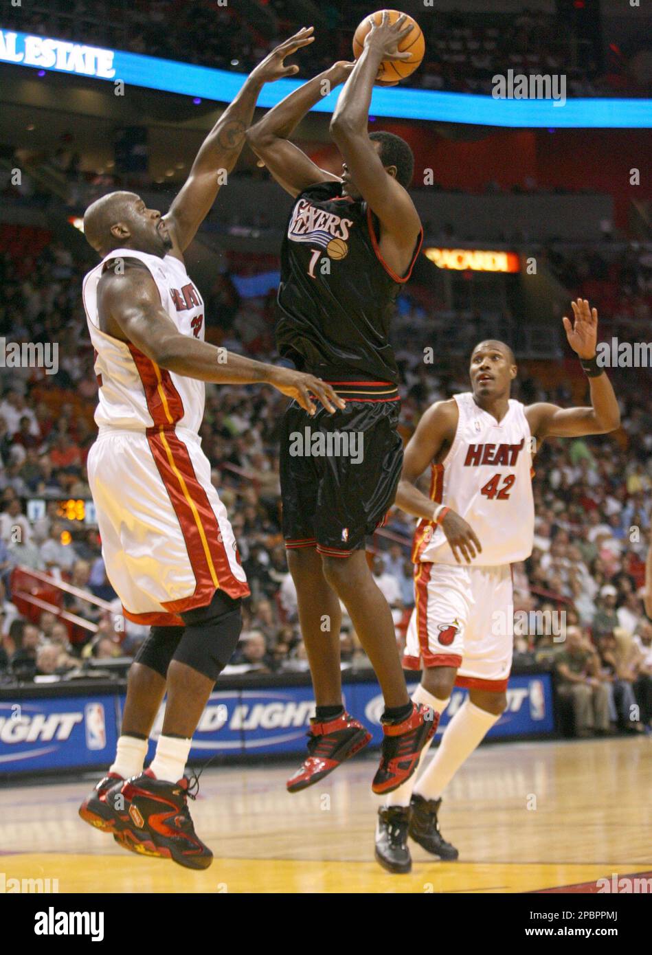 Philadelphia 76ers' Samuel Dalembert, center, of Haiti, shoots past ...