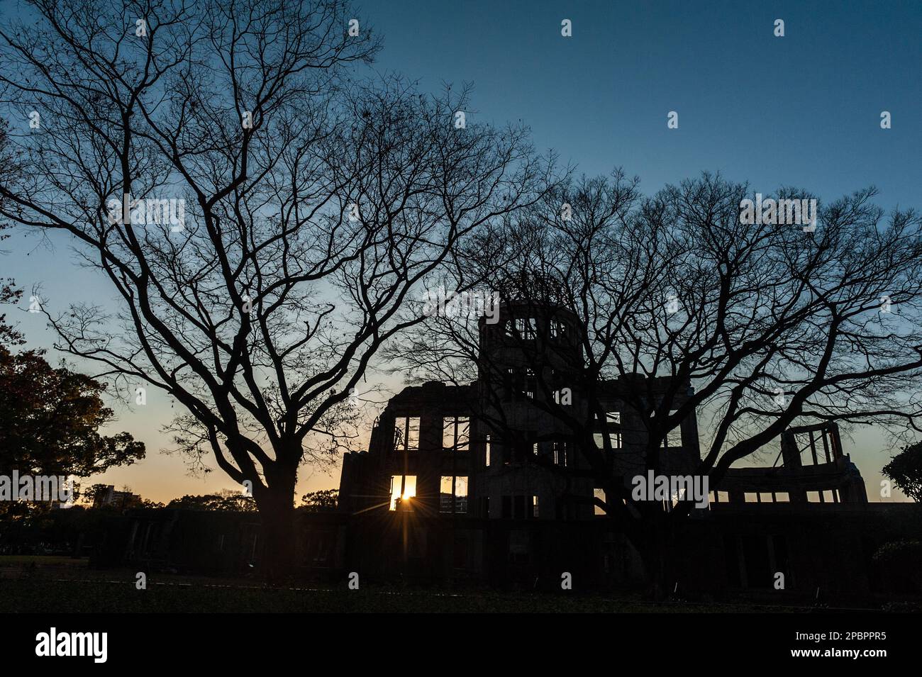 The last rays of the setting sun falling through one of the windows of ...