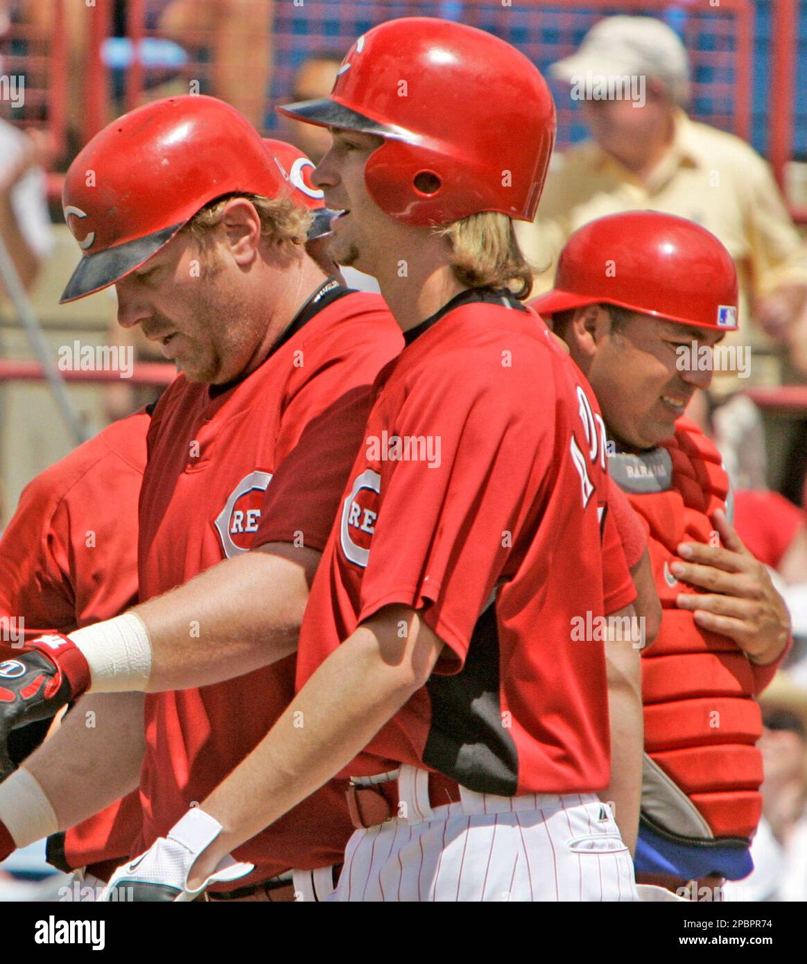 Cincinnati Reds' Adam Dunn, left, is greeted by teammate pitcher ...