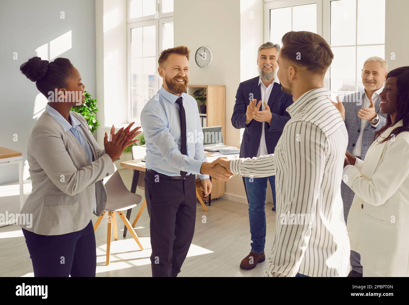 Happy business teams making a deal, showing recognition to each other ...