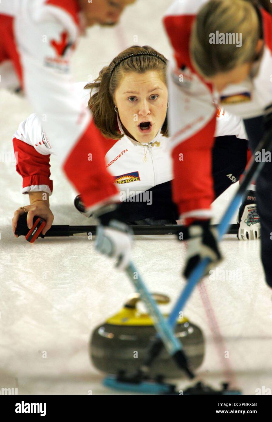 Team Canada's skip Kelly Scott , center, watches a stone as teammates ...