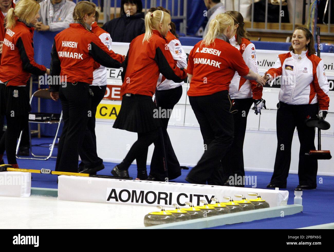 Canada's skip Kelly Scott, right, shake hands with Denmark's skip ...