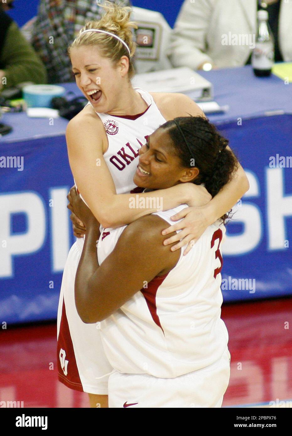 ** FILE ** Oklahoma guard Erin Higgins, top, celebrates with center ...