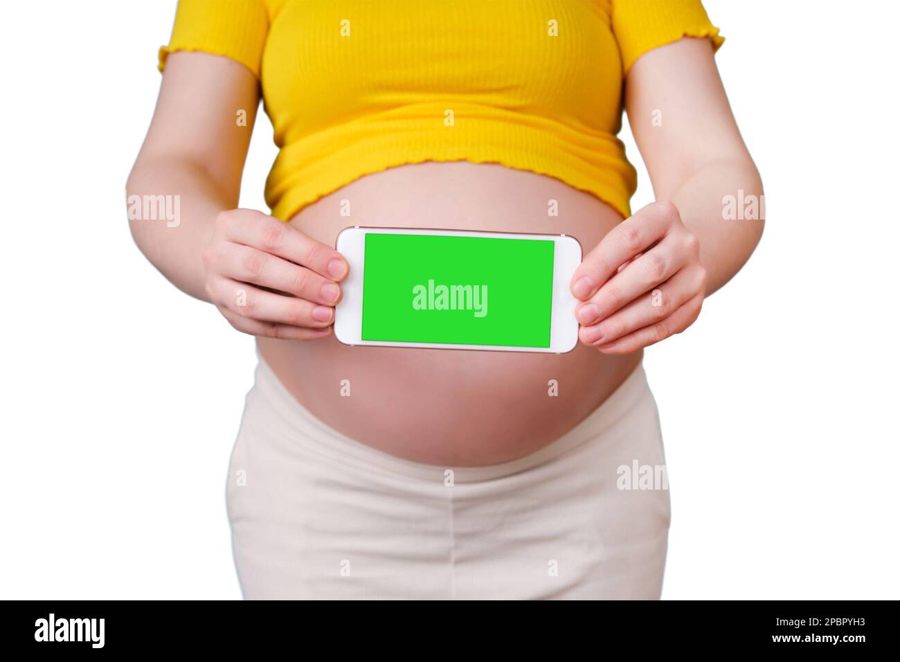 Green phone screen in the hands of a pregnant woman, mockup, isolated ...