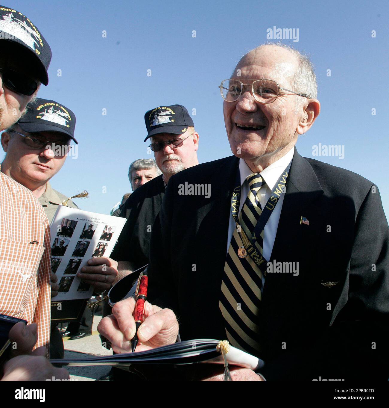 Retired Admiral Earl Yates, right, signs autographs and visits with ...