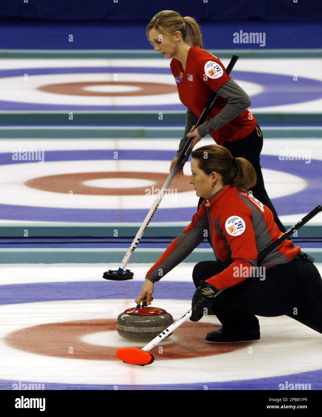The United State's skip Debbie McCormick, bottom prepares to release ...