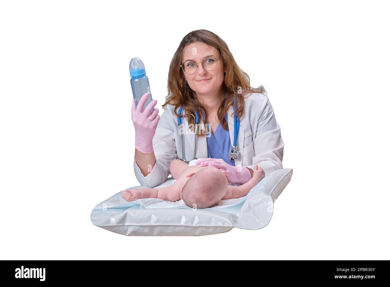 Woman doctor feeding a newborn baby from a bottle, isolated on a white ...